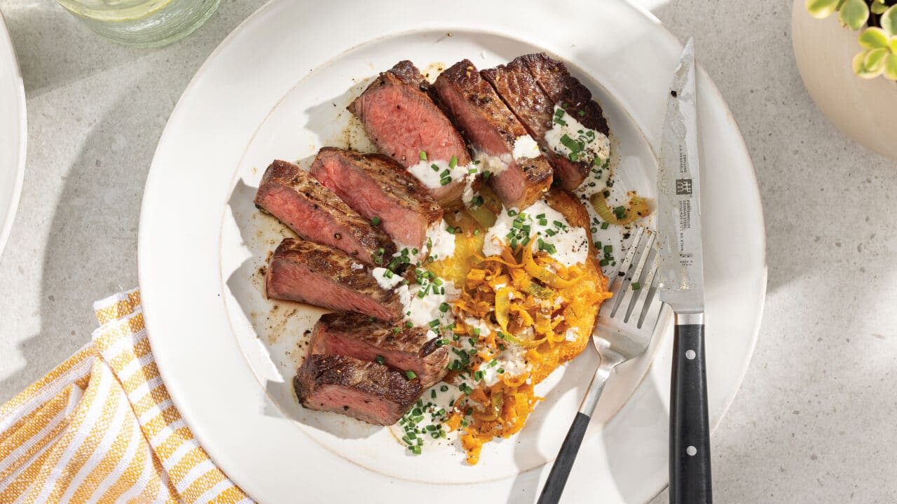 New York Strip With Garlic Aioli, Hash Browns, and Melted Leeks Recipe